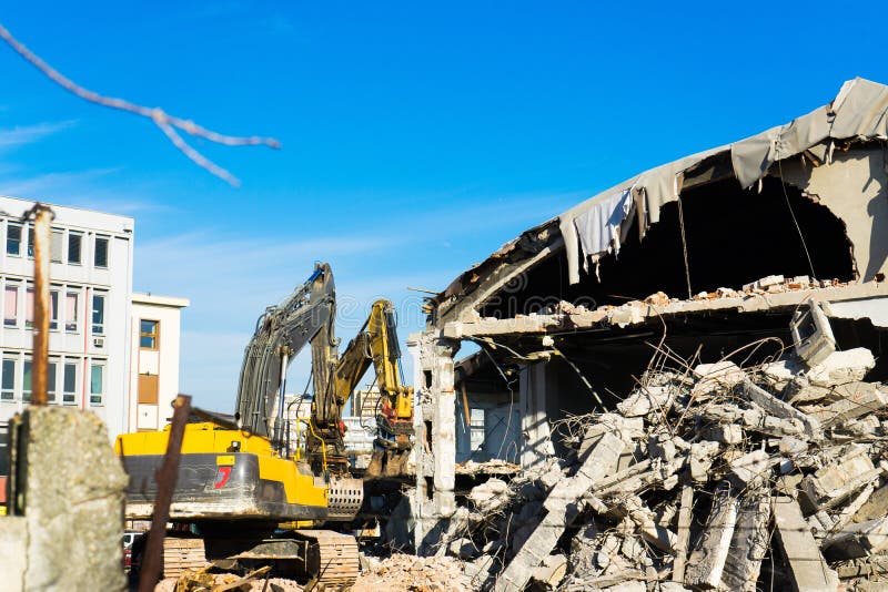 Demolition of the Old Building with Sloopkraan Against Blue Clouds Sky ...