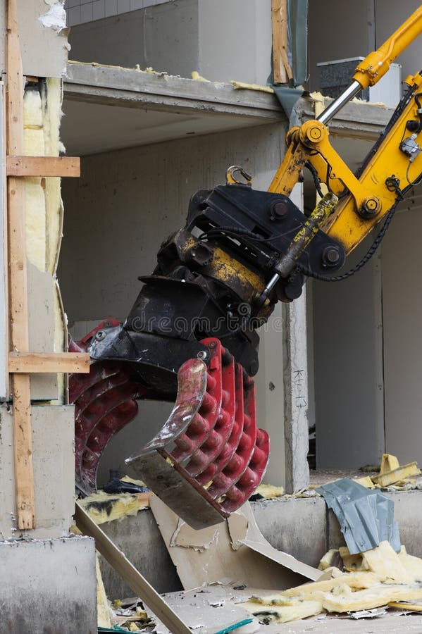 Excavator with Grab Breaking Down a House Stock Photo - Image of ...