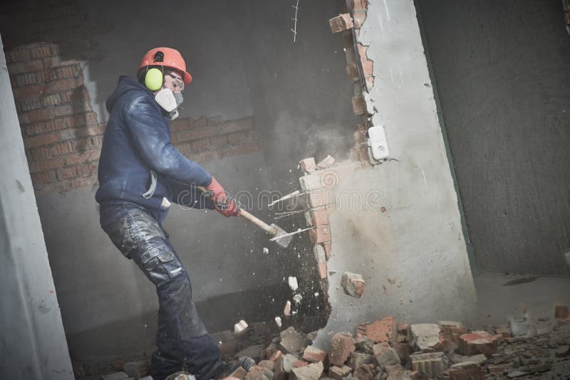 Demolition Work and Rearrangement. Worker with Sledgehammer Destroying ...