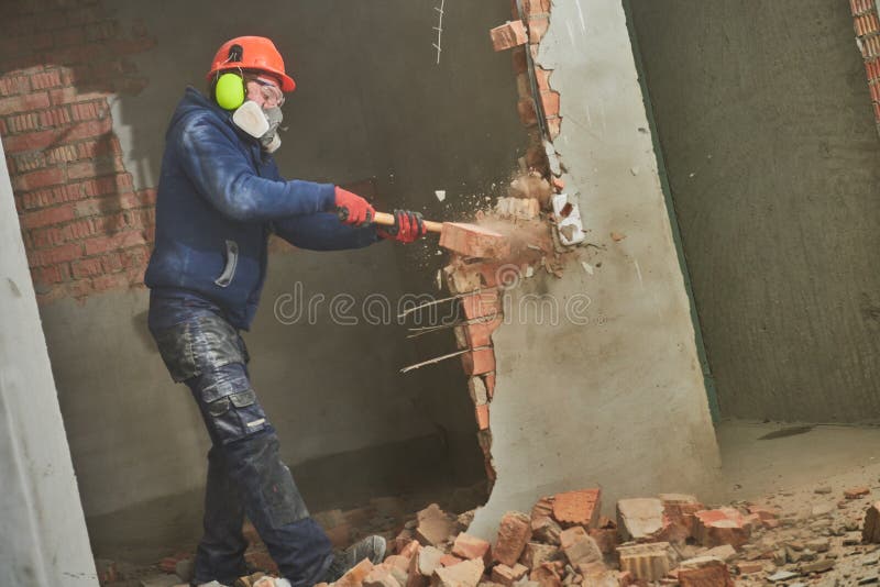 Demolition Work and Rearrangement. Worker with Sledgehammer Destroying ...