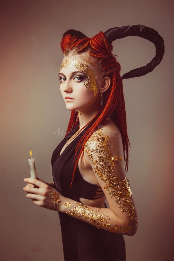 Demon Girl with Spikes on the Face and Body Stock Photo - Image of ...