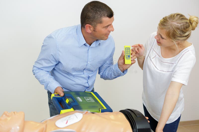 Demonstrating Firt Aid with Cpr Dummy on Table Stock Image - Image of ...