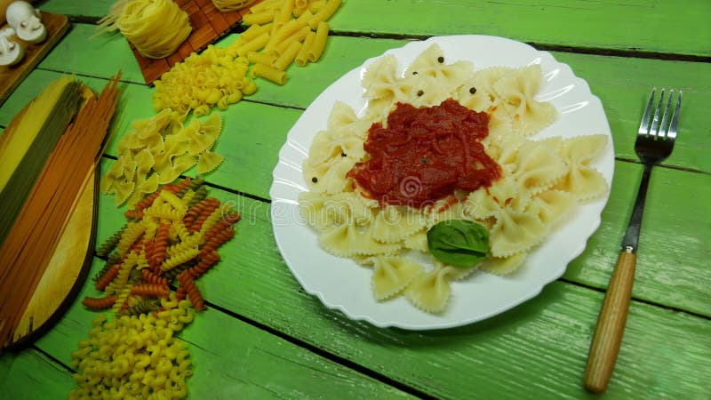Cooked Pasta on White Plate with Tomatoes. Top View. Stock Image ...