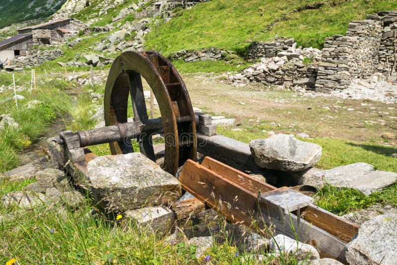 Spinning Water Wheel in the Mountains of Tirol, Austria Stock Photo ...