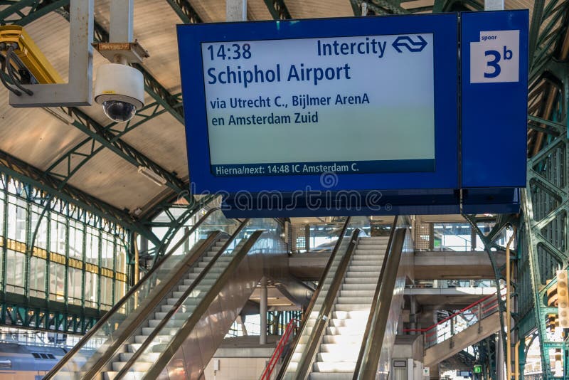 Railway Station Concourse with Information Panel and Exit Sign ...