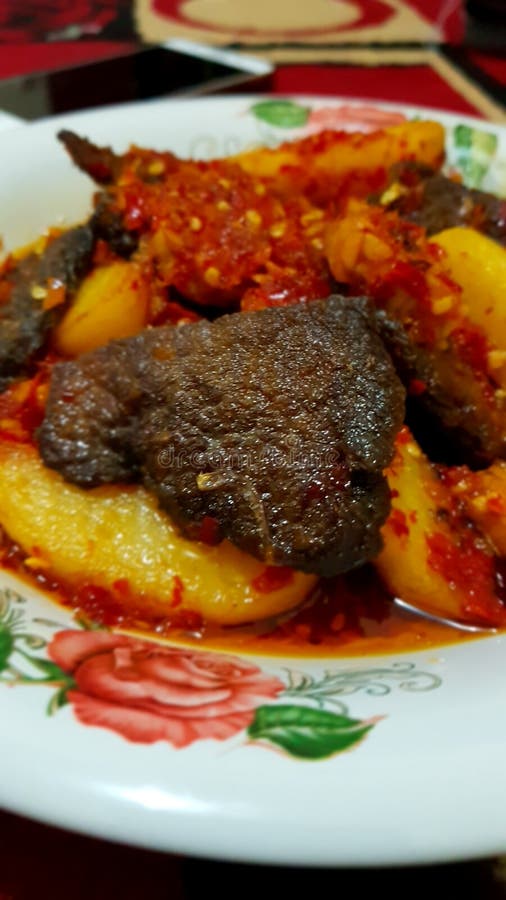 Dendeng Batoko with Fried Potato Stock Photo - Image of fish, meat ...