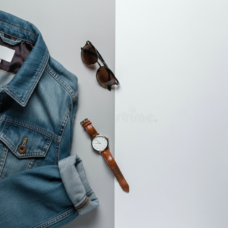 Denim Jacket with a Buttoned Pocket, Partially Folded Sleeves on a Gray ...