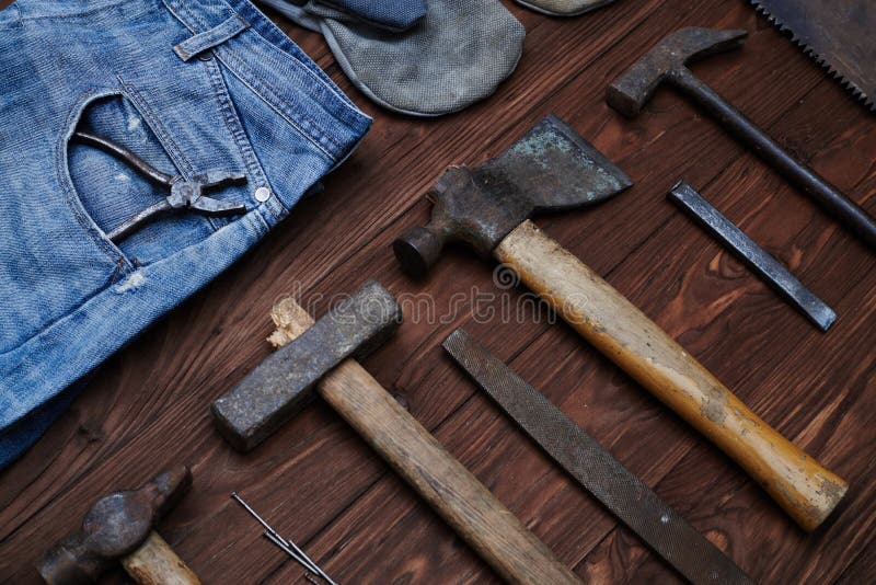Denim Jeans and Carpenter Worn Tools Kit Over Wooden Background Stock ...