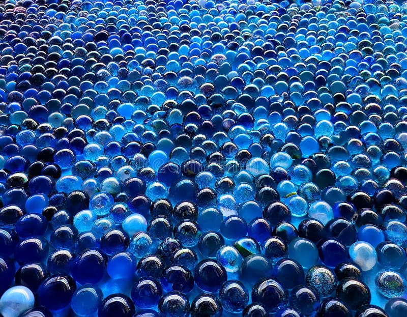 A Densely Filled Background of Shiny Blue Glass Marbles Stock ...