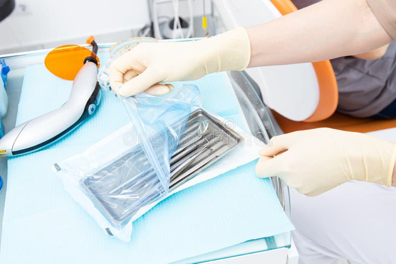 Dental Appliances in Sterile Packaging. Dentist& X27;s Hand in Gloves ...