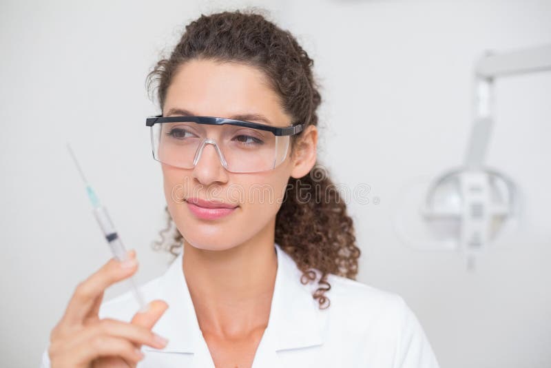 Dental Assistant Preparing an Injection Stock Photo - Image of ...