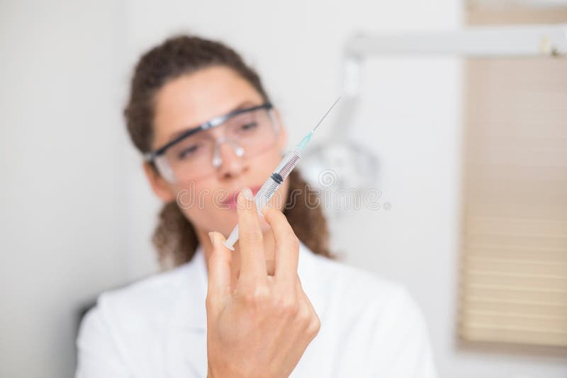 Dental Assistant Preparing an Injection Stock Image - Image of ...