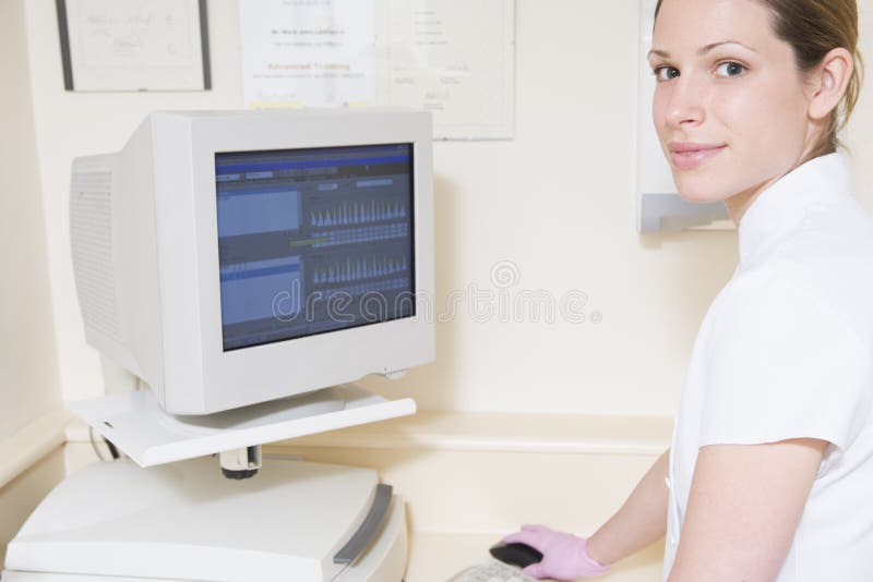 Dental Assistant Using Computer Smiling Stock Photo - Image of ...