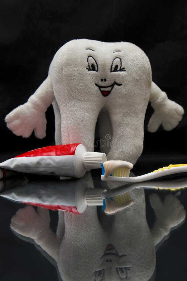 Toothpaste, Toothbrush, and a Tooth Figurine Stock Photo - Image of ...