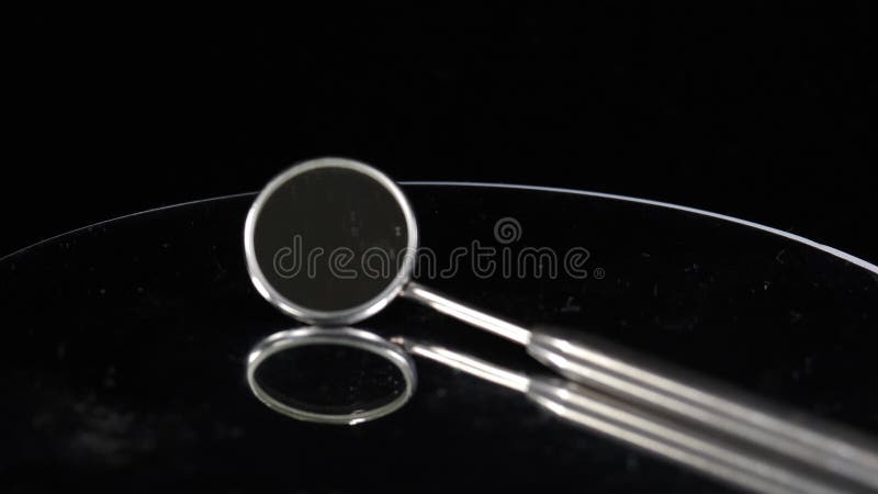 Dental Diagnostic Instruments Rotating on Black Background Surface ...