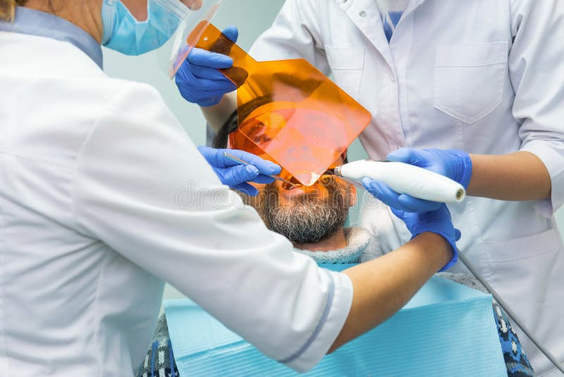 Dental doctors at work. stock photo. Image of female - 88860864