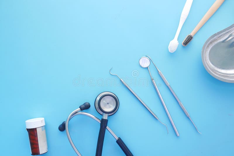 Dental Equipment , Stethoscope and Pill Container on Blue Stock Image ...