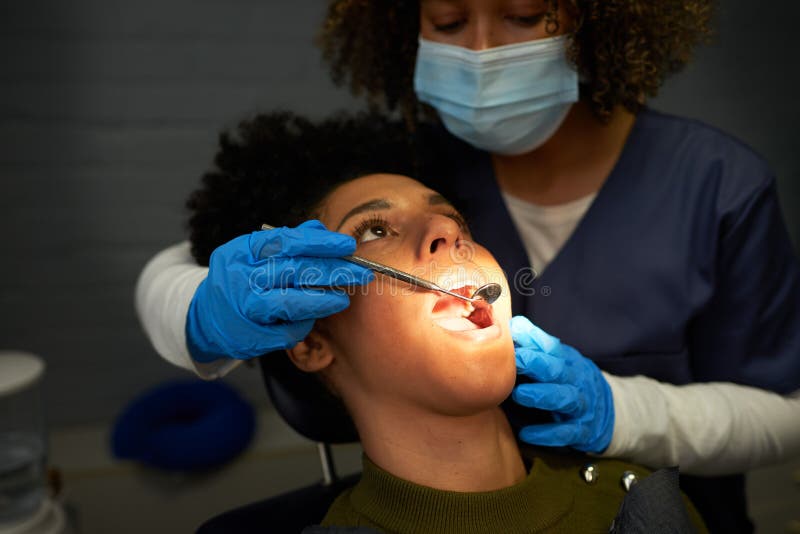 Dental Examination Performed by a Professional Dentist Using Proper ...