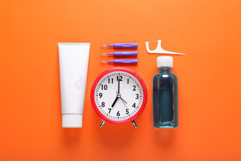 Dental Floss, Toothpaste and Mouthwash on Orange Background, Flat Lay ...
