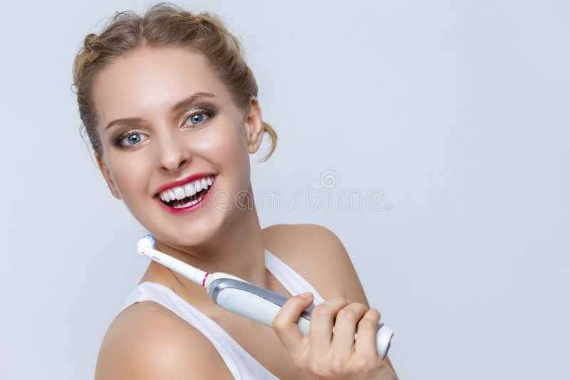 Dental Healthcare Smiling Caucasian Blond Woman In Bra Cleaning Teeth