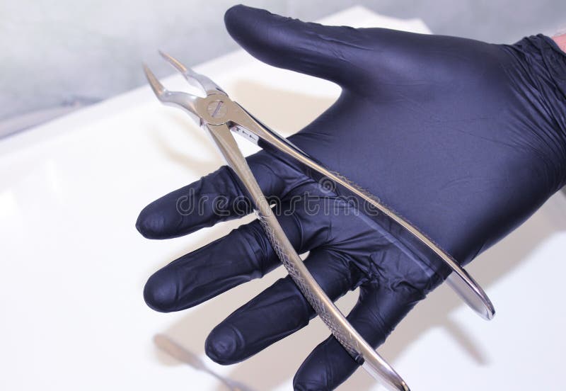 Dental instrument stock photo. Image of treatment, hand - 99687966