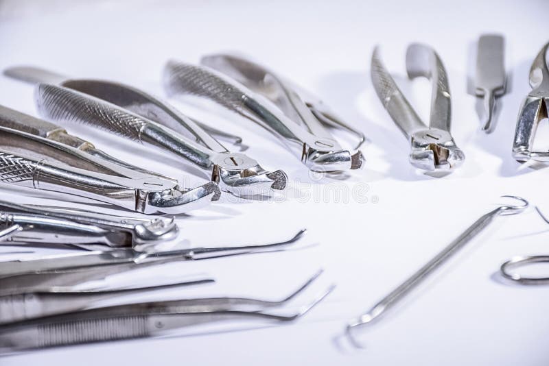 Dental Instruments Arranged on White Table. Stock Photo - Image of ...