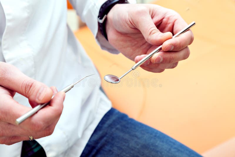 Dental Instruments in the Hands of a Doctor. Stock Photo - Image of ...