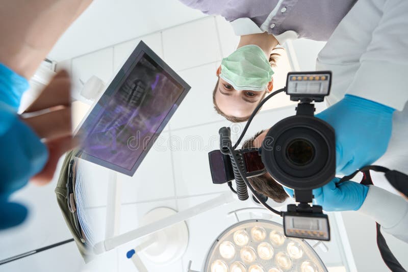 Dental Practitioner Photographing Client Teeth with Digital Camera ...