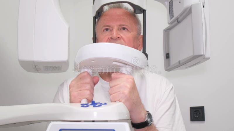 Dental X-ray Machine with a Cephalometric Socket, an Elderly Man Takes ...