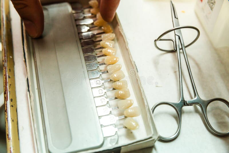 Dental Shade Guide with Metal Tools on a Table Stock Photo - Image of ...