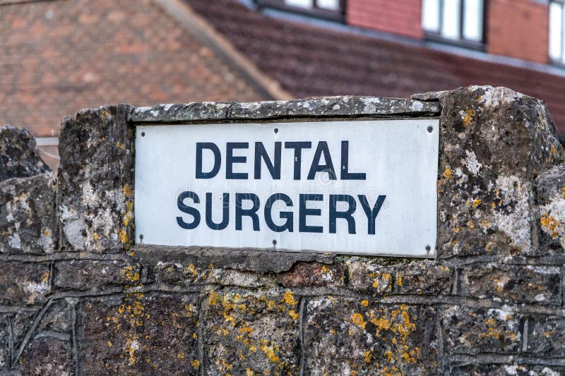 Dental Surgery Sign Mounted on a Weathered Stone Wall with Lichen Stock ...