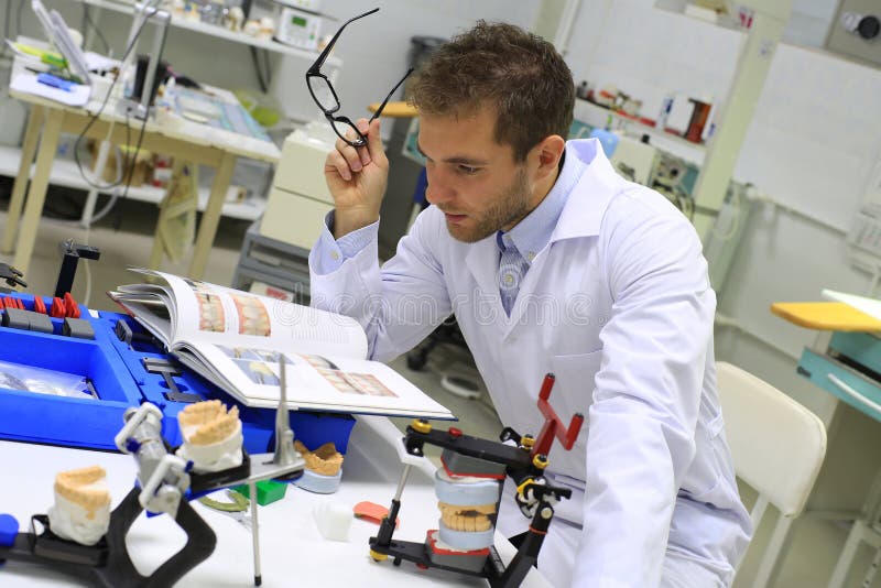 Dental technician stock photo. Image of young, dental - 79790706