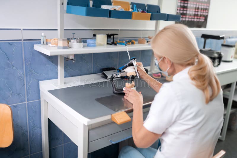 Dental Technician Constructing Prosthetic Denture for the Patient ...