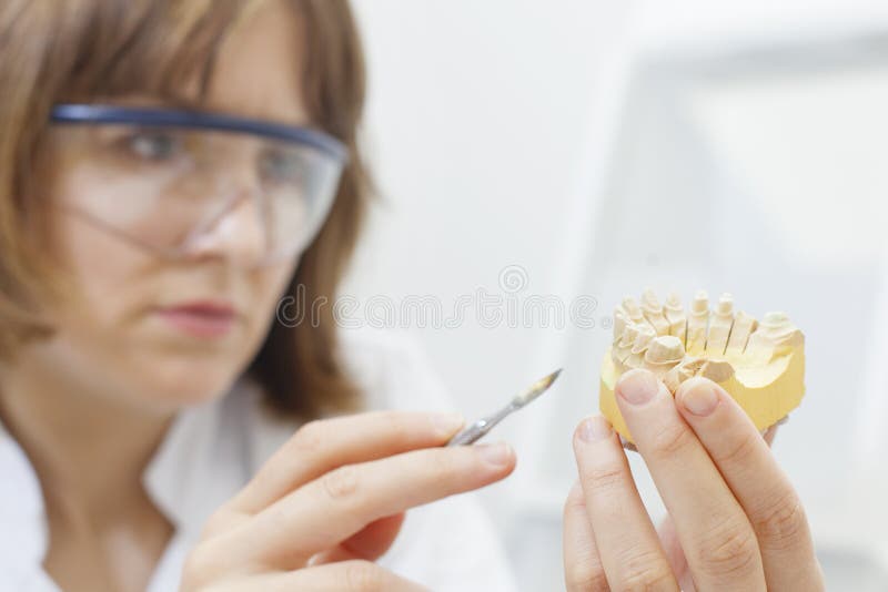 Dental Technician Shaping a Prosthesis Tooth Stock Photo - Image of ...