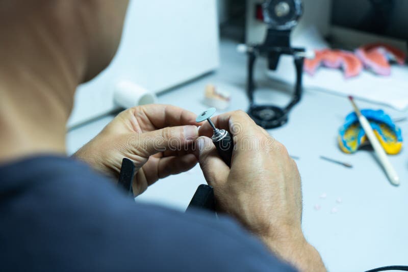 Dental Technician Works in His Workshop and Makes Artificial Teeth for ...