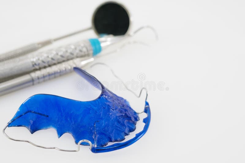 Dental tools and retainer. stock image. Image of object - 114446521