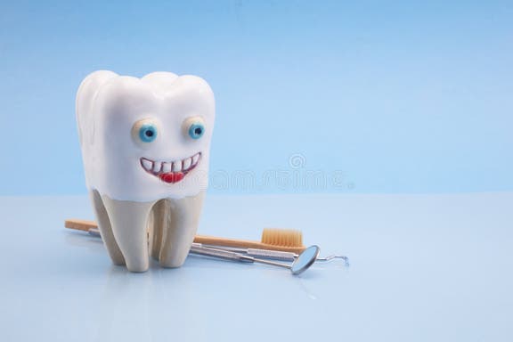 Dental Tools and Tooth Model. Smiling Tooth Figurine with Dental Tools ...