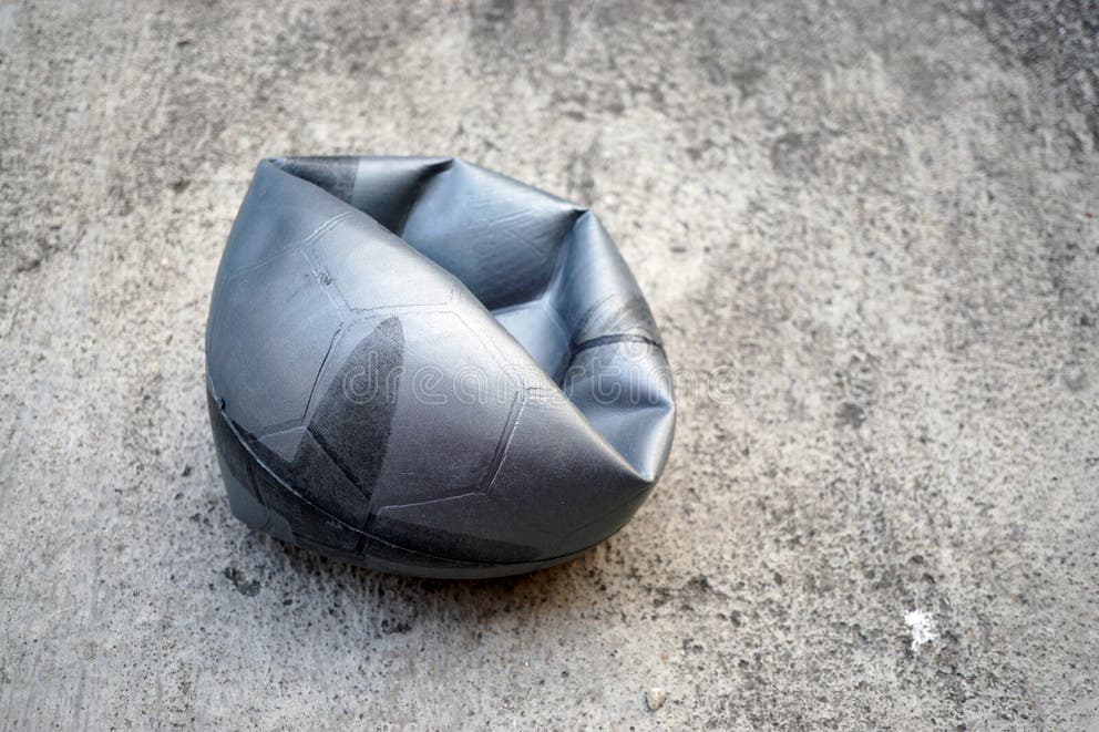 Dented Plastic Soccer Ball on the Road Stock Photo - Image of plastic ...