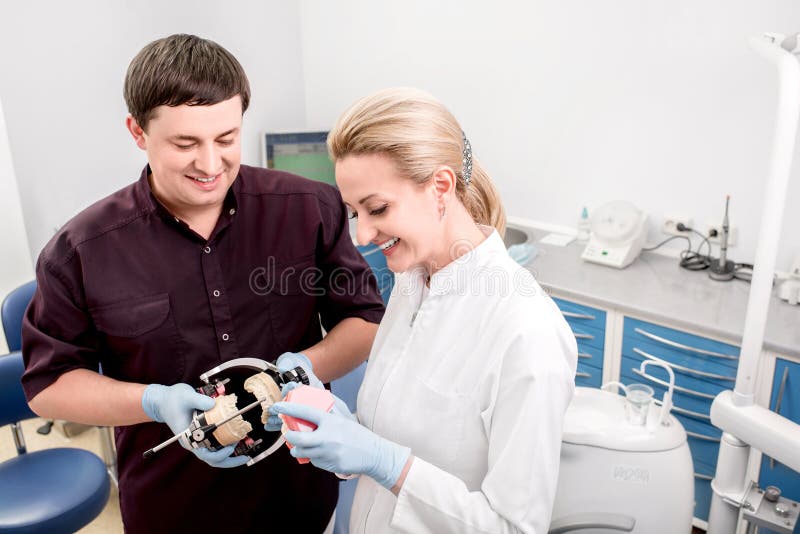 Dentist with Assistant in the Dental Office Stock Photo - Image of ...