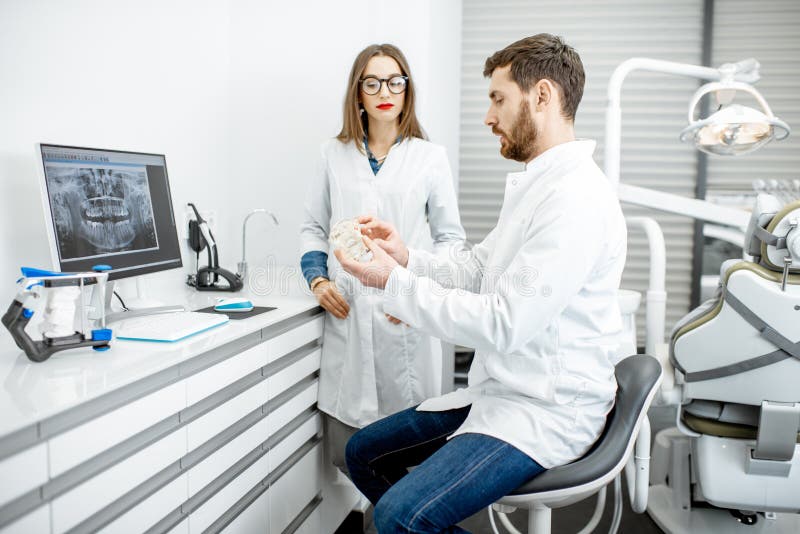 Dentist with Assistant in the Dental Office Stock Photo - Image of ...