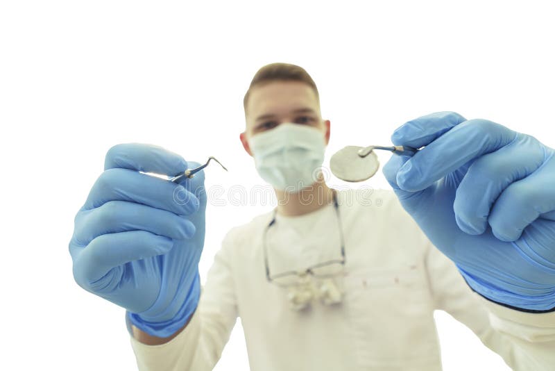 Dentist Bends Over the Patient and is about To Begin the Examination ...