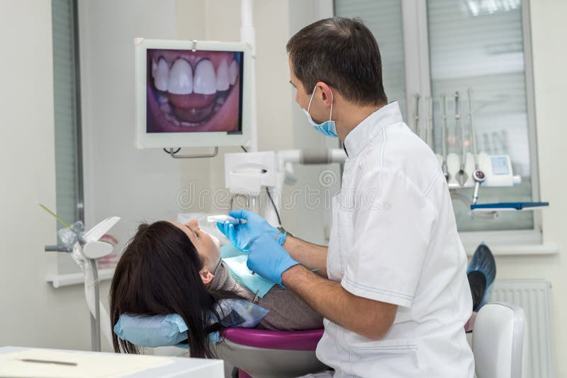 Dentist Checking Patient`s Teeth with Camera, Looking on Screen Stock ...