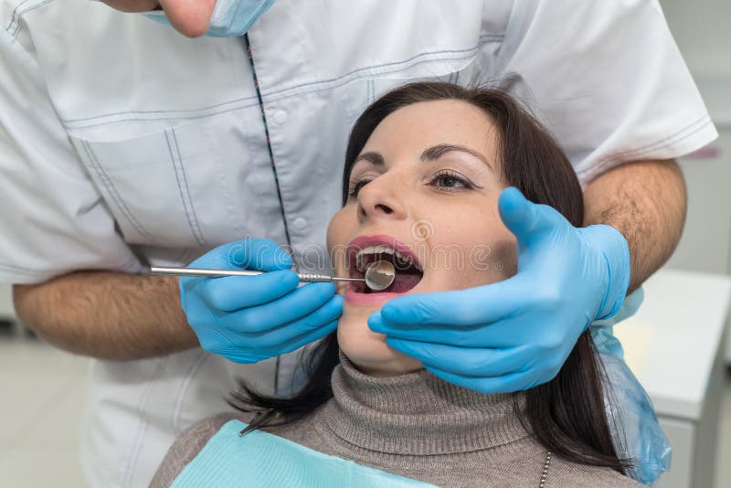 Dentist Checking Woman`s Teeth with Mirror during Visit Stock Photo ...