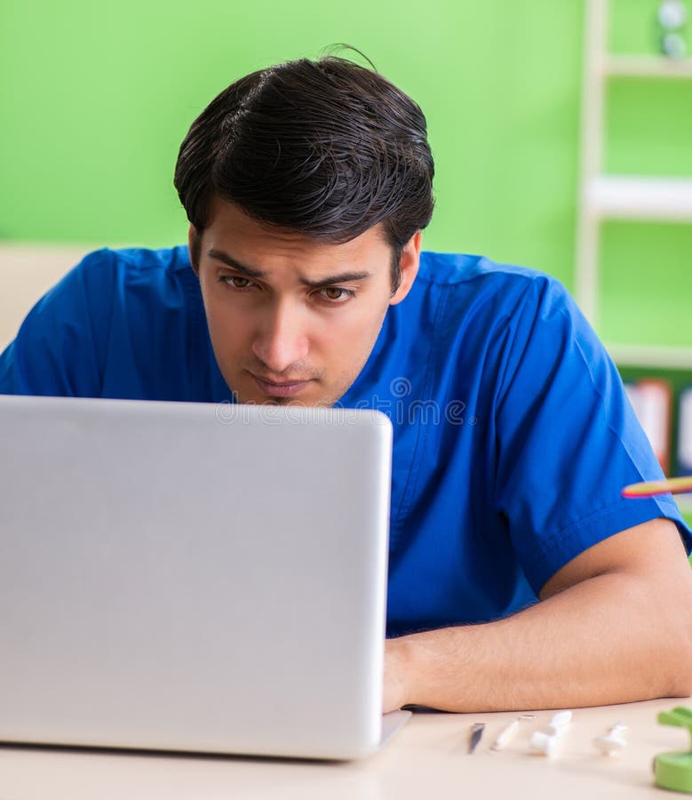 Dentist Doctor Sitting at Computer in the Clinic Stock Image - Image of ...
