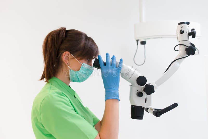 Dentist Doctor Using Dental Microscope. Stock Photo - Image of female ...