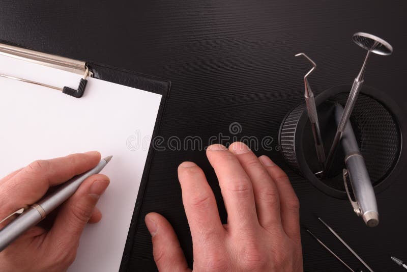 Dentist Doctor Writing on His Desk Top View Stock Photo - Image of ...