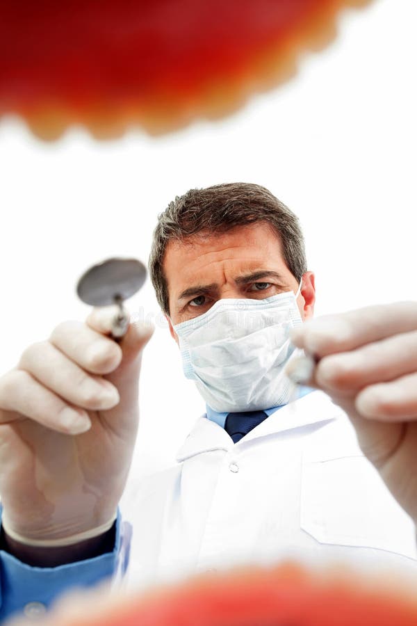 Dentist in the examination stock image. Image of mask - 195688595