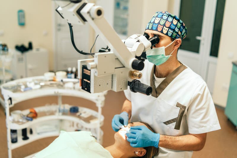Dentist Examine Oral Cavity of Female Patient with Microscope. Stock ...