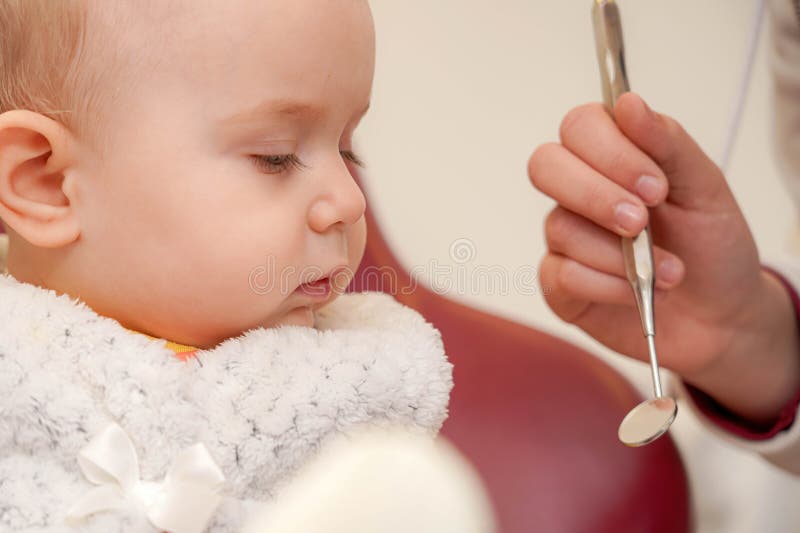 The Dentist Examines the Child and Checks the Baby Teeth Stock Image ...