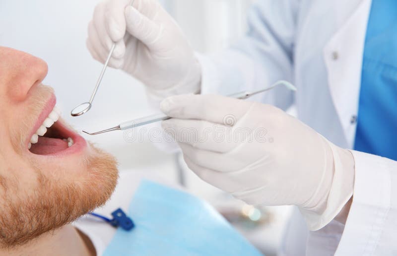 Dentist Examining Patient`s Teeth in Modern Clinic Stock Photo - Image ...